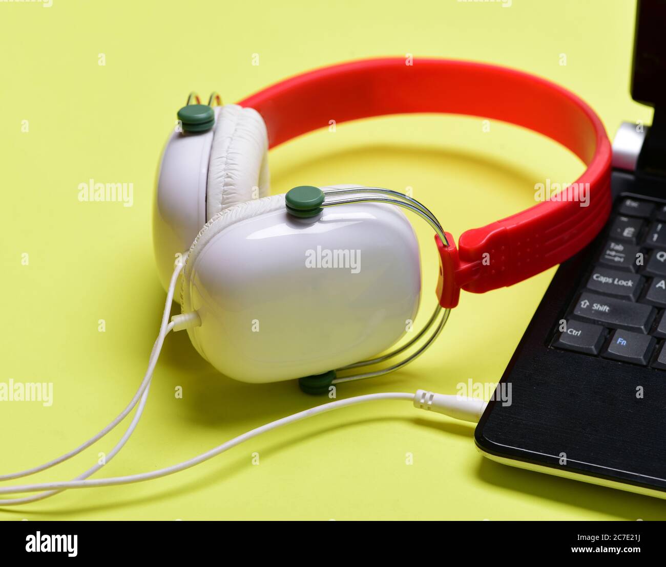 Headphones and black laptop. Music and digital equipment concept ...