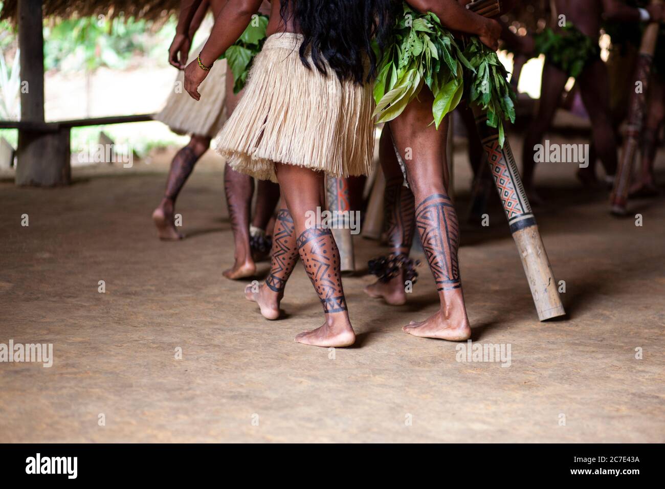 Indigenous Amazonian men perform a traditional tribal ceremony with ...