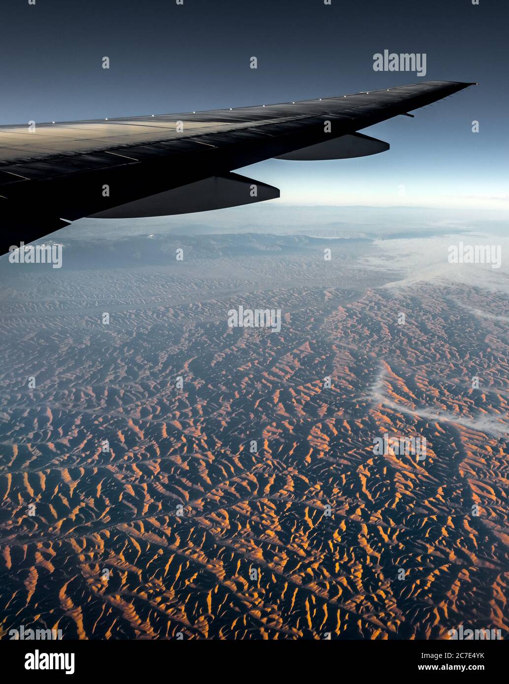 Aerial View from an Airplane. Flying above Beautiful Land at Sunrise ...