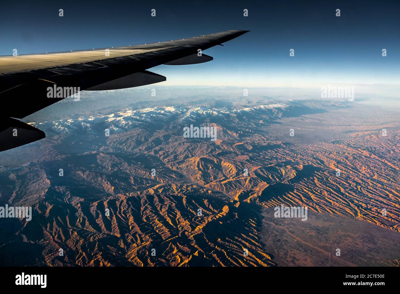 Aerial View from an Airplane. Flying above Beautiful Land at Sunrise ...