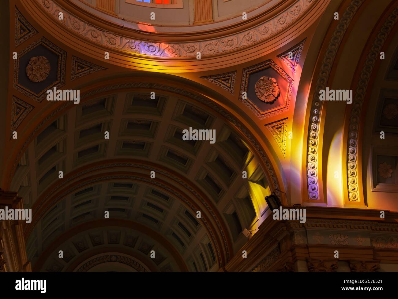 Colorful light hitting the high ceiling walls of the Roman Catholic Our ...