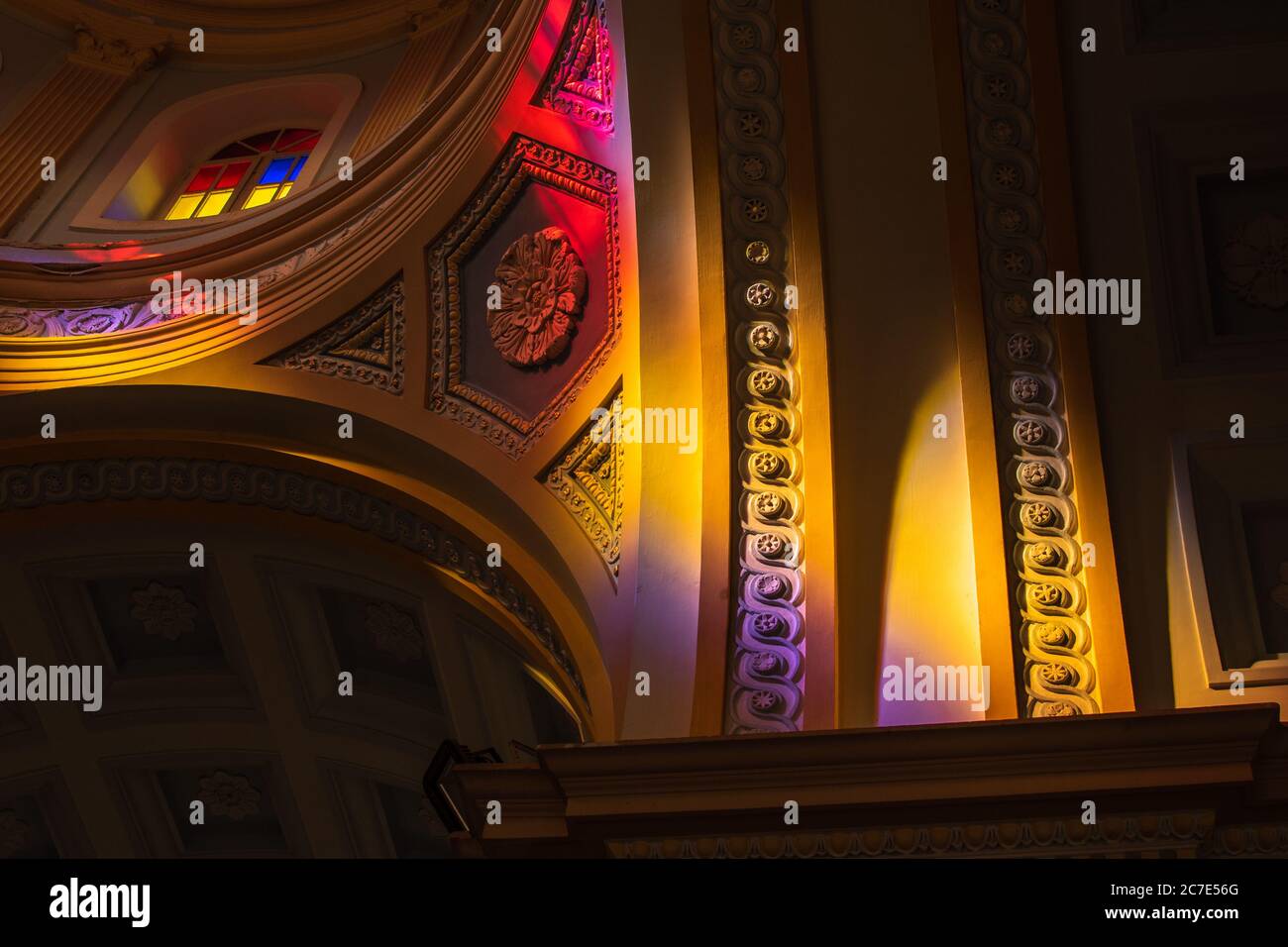 Colorful light hitting the high ceiling walls of the Roman Catholic Our ...