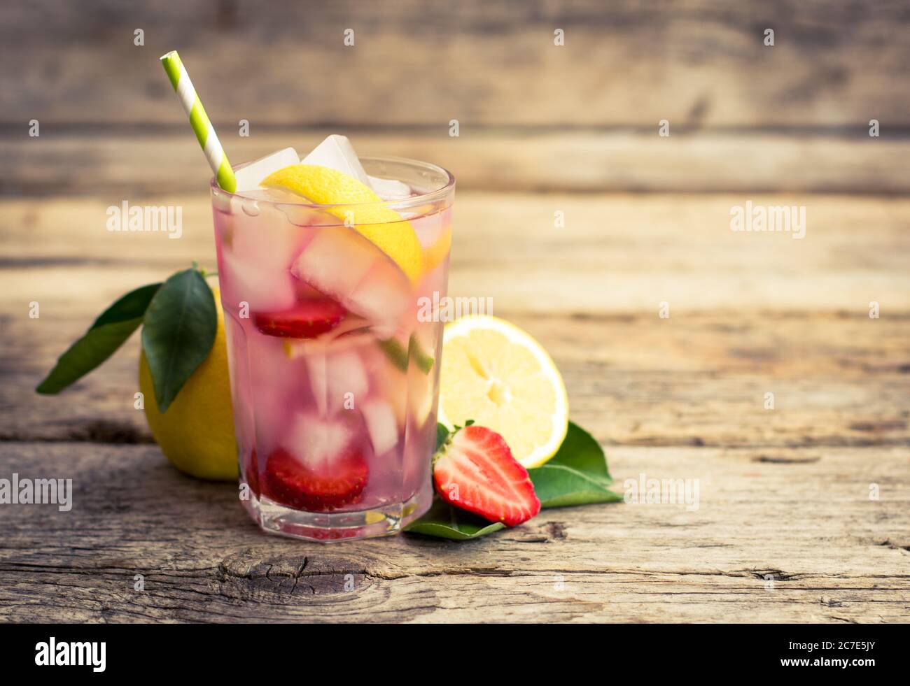 Homemade fresh pink lemonade with lemon, lime and strawberries Stock ...
