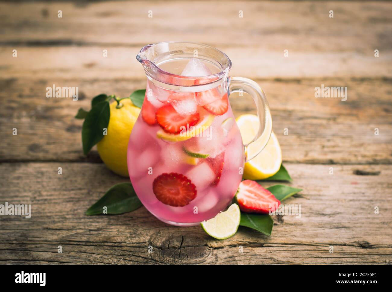 Homemade fresh pink lemonade with lemon, lime and strawberries Stock ...