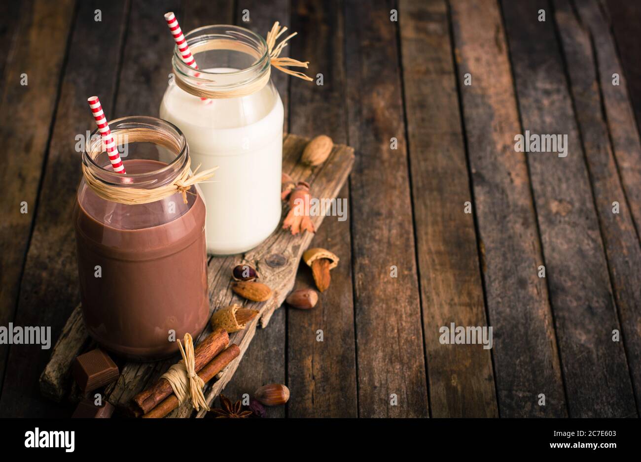 Chocolate and regular milk in the glass jar Stock Photo - Alamy