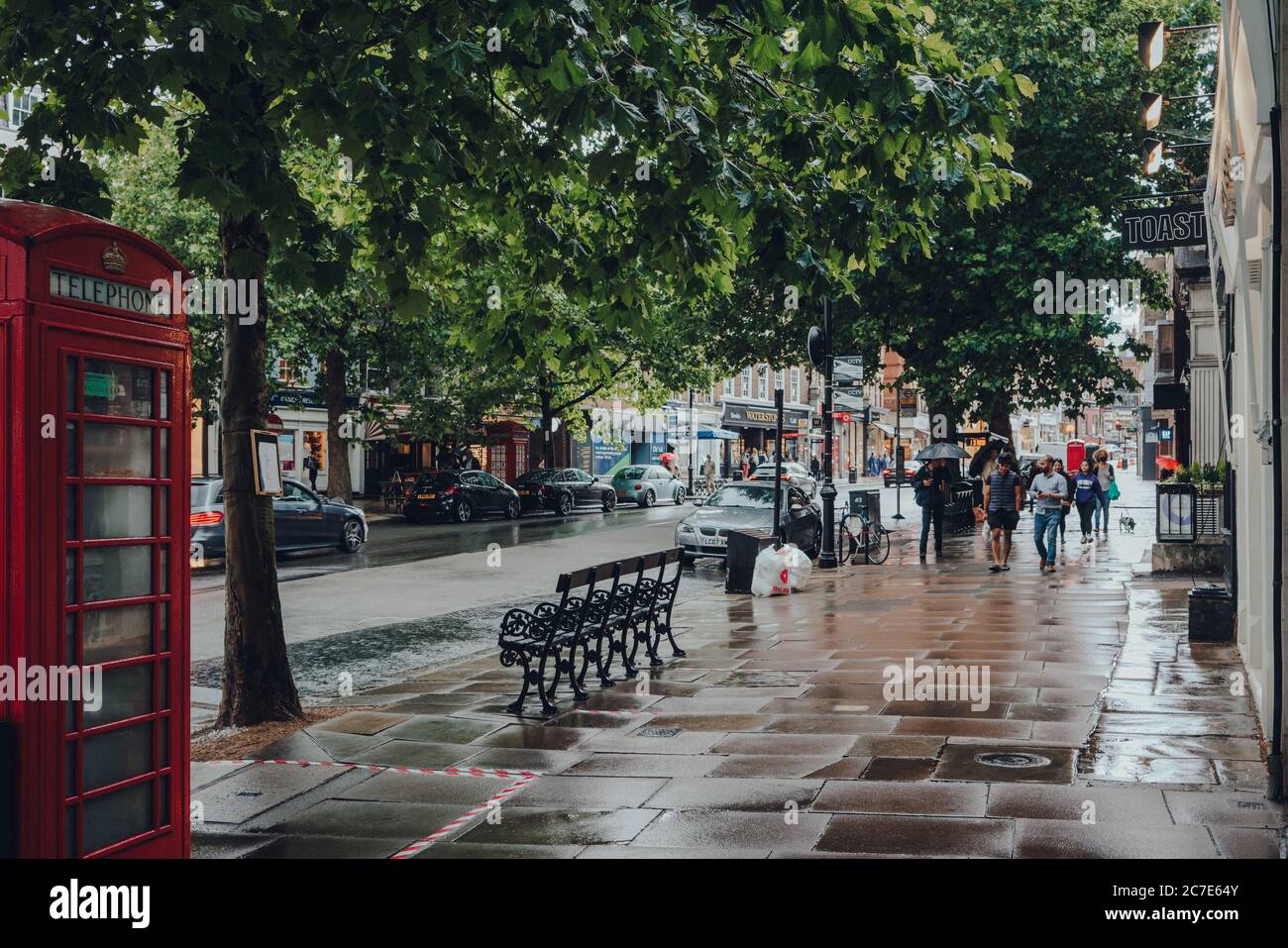 London, UK - July 02, 2020: View of Hampstead High Street in the rain ...