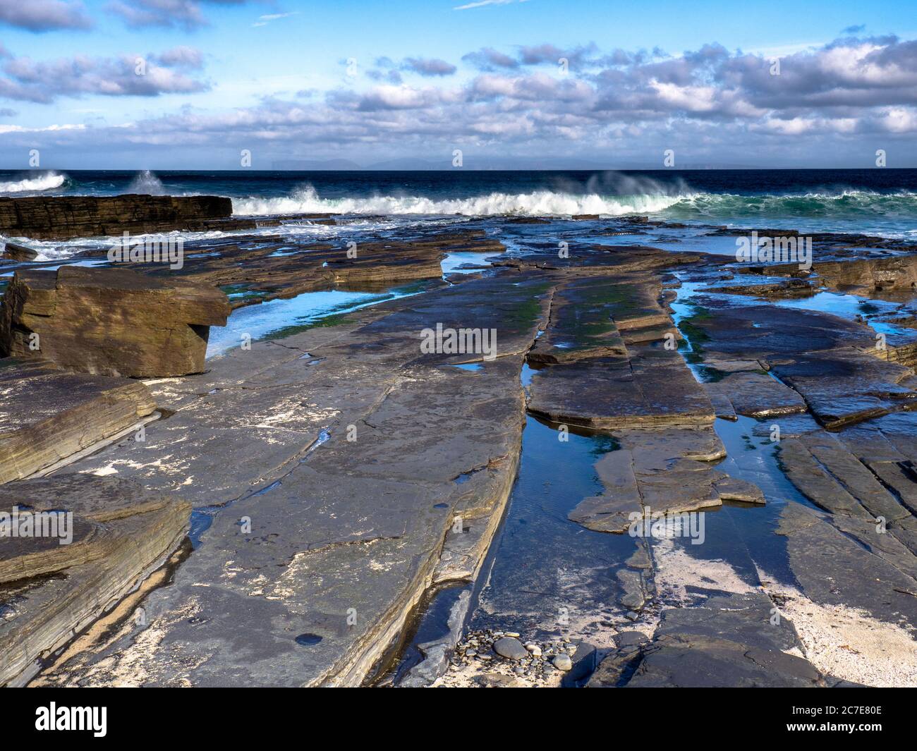 Rolling tide on a rocky Scottish shoar Stock Photo - Alamy