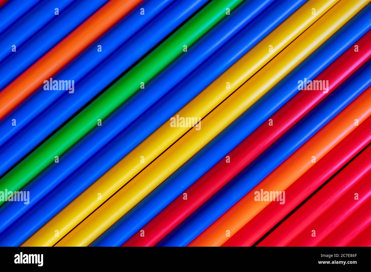 Colorful plastic tubes straws diagonal background Stock Photo - Alamy