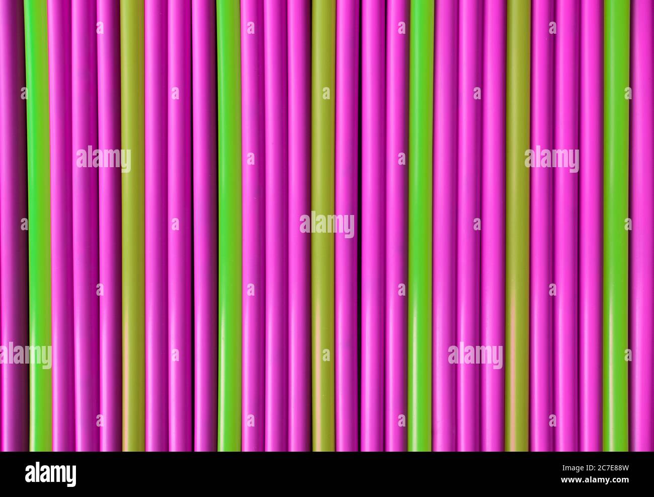 Neon pink and green pattern plastic tubes straws background Stock Photo ...