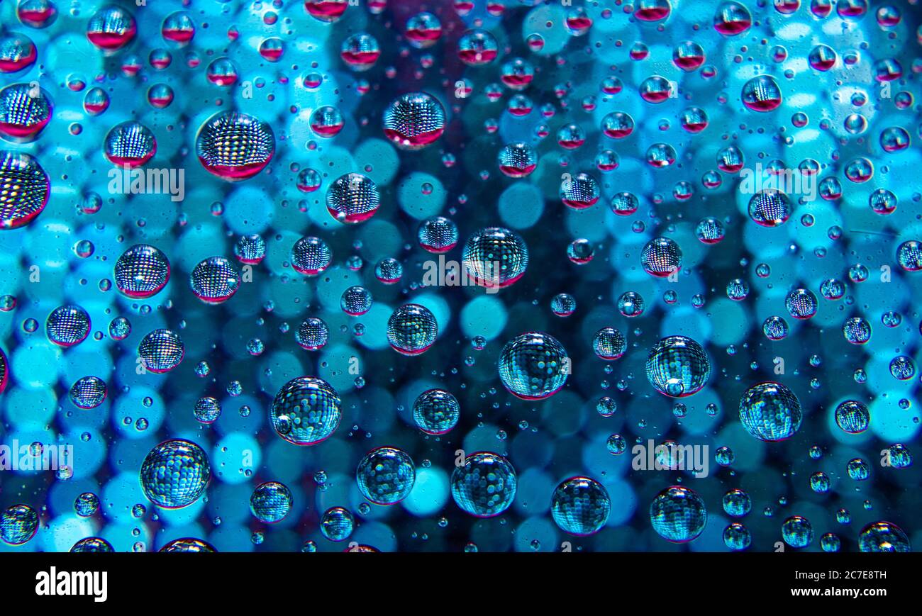 Abstract water drops in shiny blue and silver background Stock Photo ...