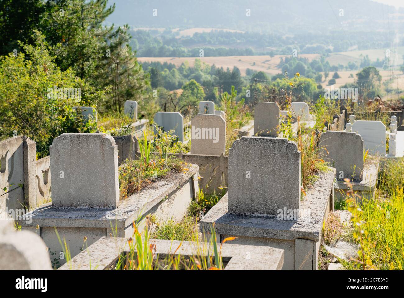 Country cemetery with green plants in Turkey at sunset Stock Photo - Alamy