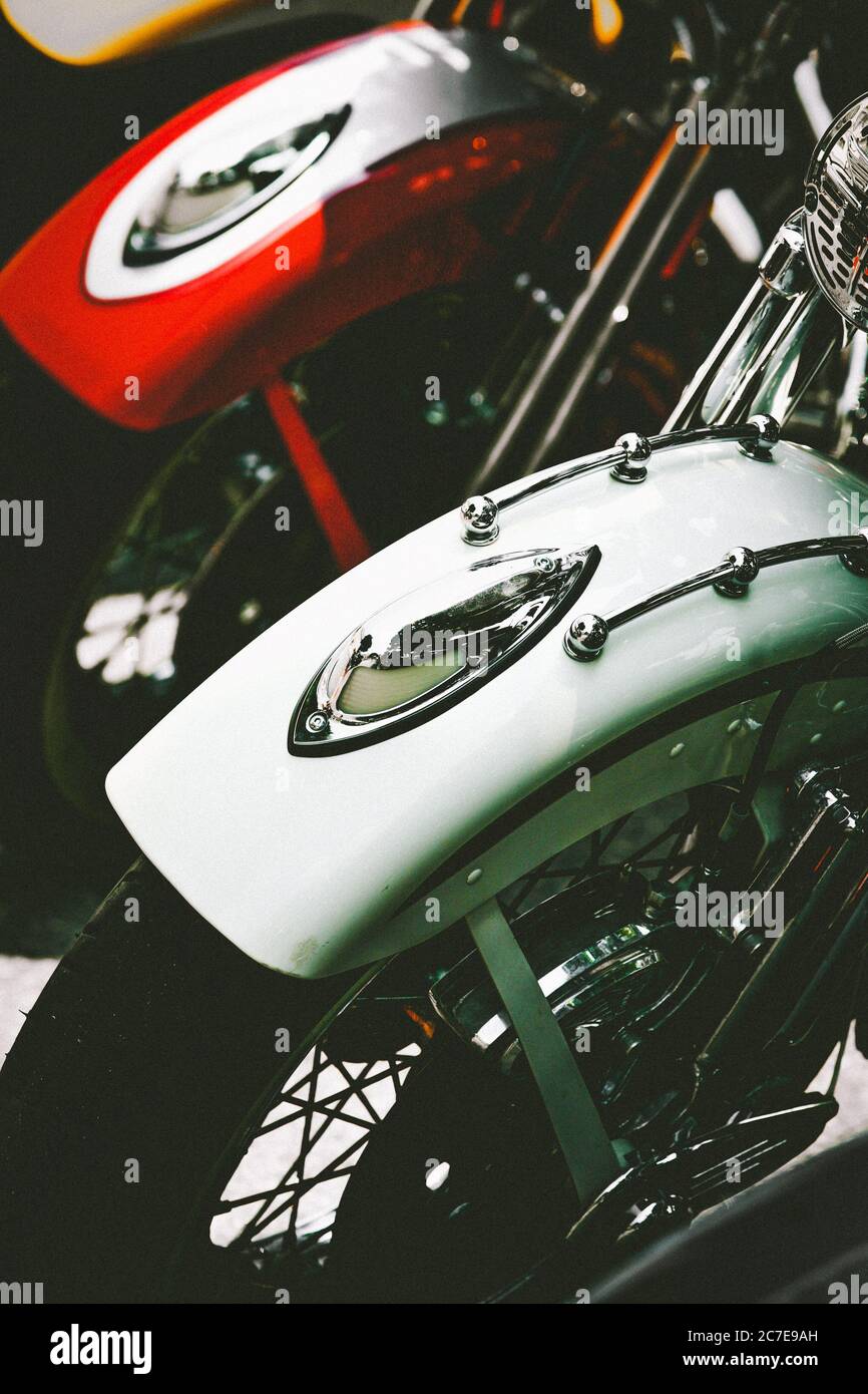 Vertical closeup shot of parked motorcycles ready for the racing during ...