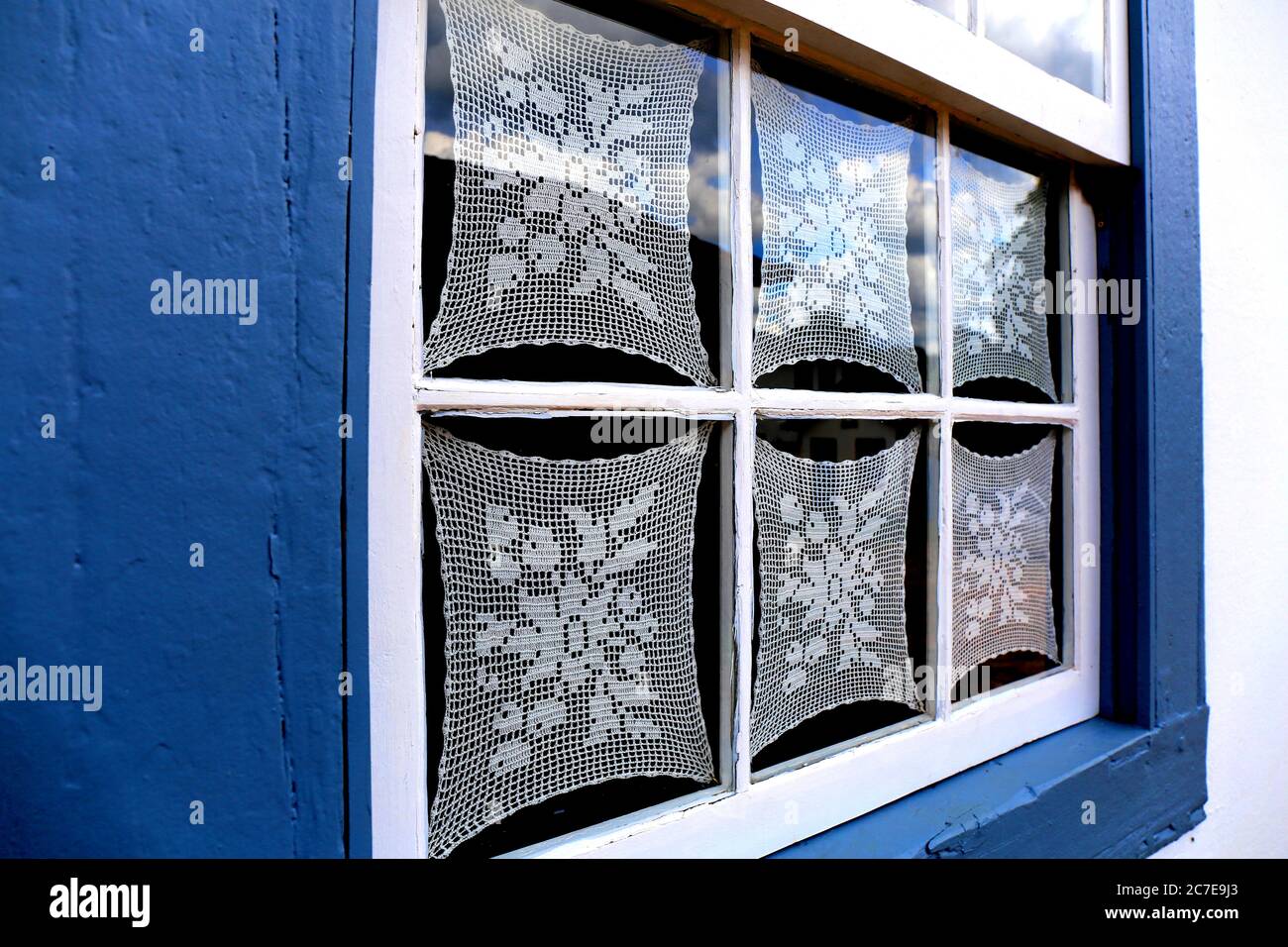 Traditional embroidery and a blue window Stock Photo - Alamy