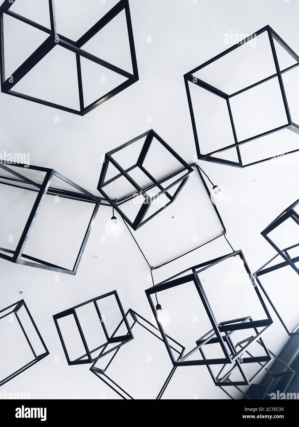 Vertical shot of decorative grey metal cubes in a white room - perfect ...