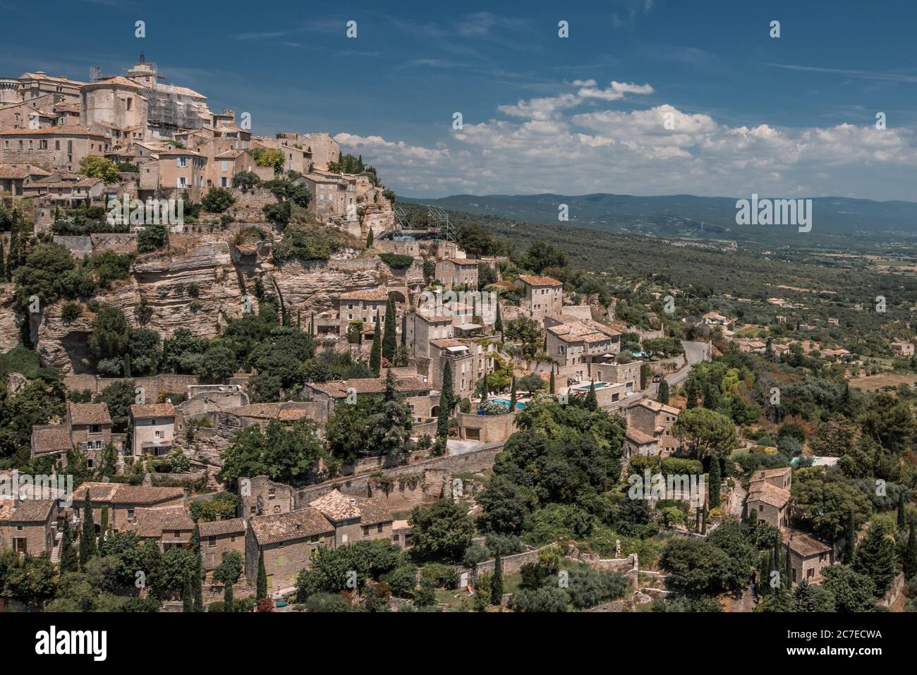 Beautiful high angle shot of hills covered with trees and buildings in ...
