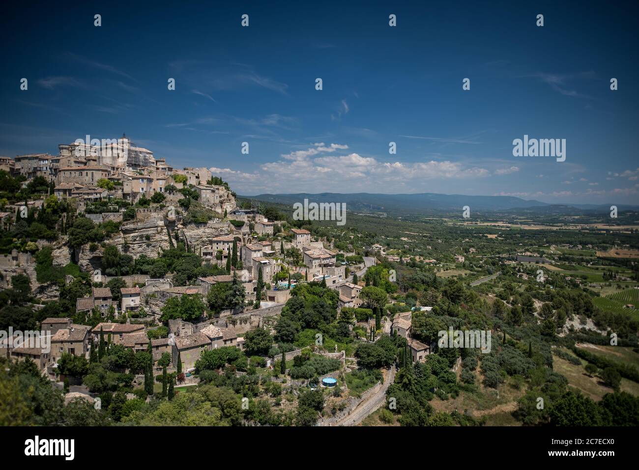 Beautiful high angle shot of hills covered with trees and buildings in ...