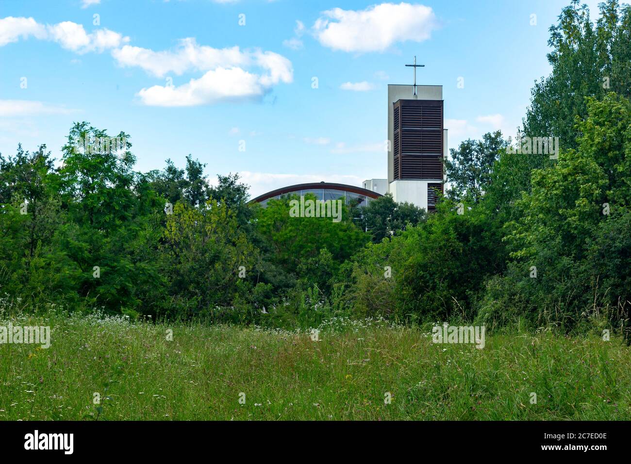 a church in the landscape in the summer and a beautiful sky in the ...