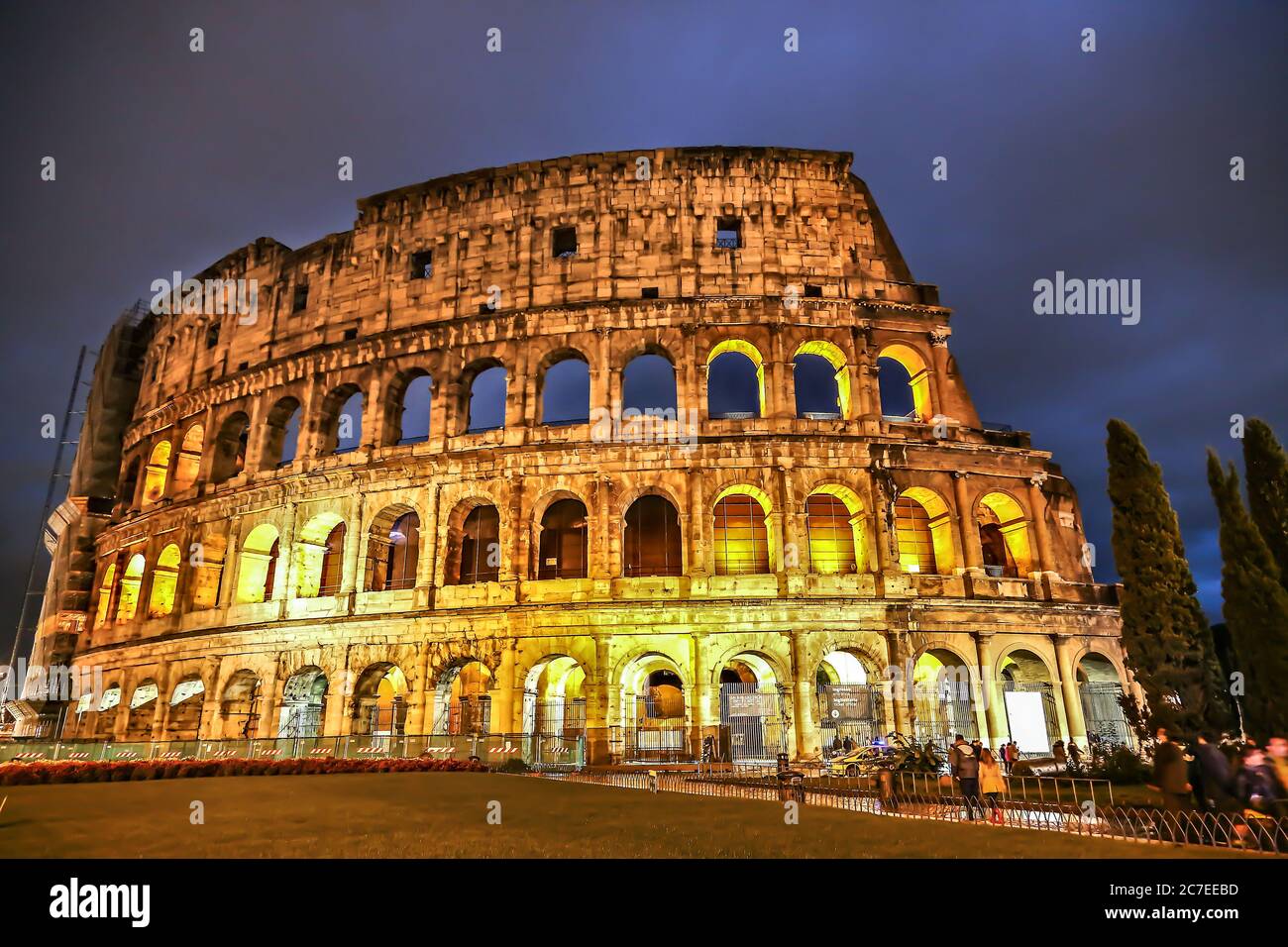 Low angle shot of Colosseum with lights in the center of Rome, Italy at ...