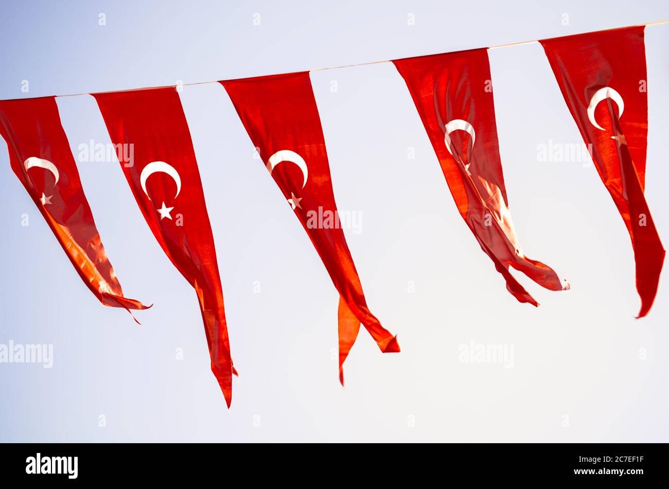 Turkish national flags with white star and moon in sky Stock Photo - Alamy