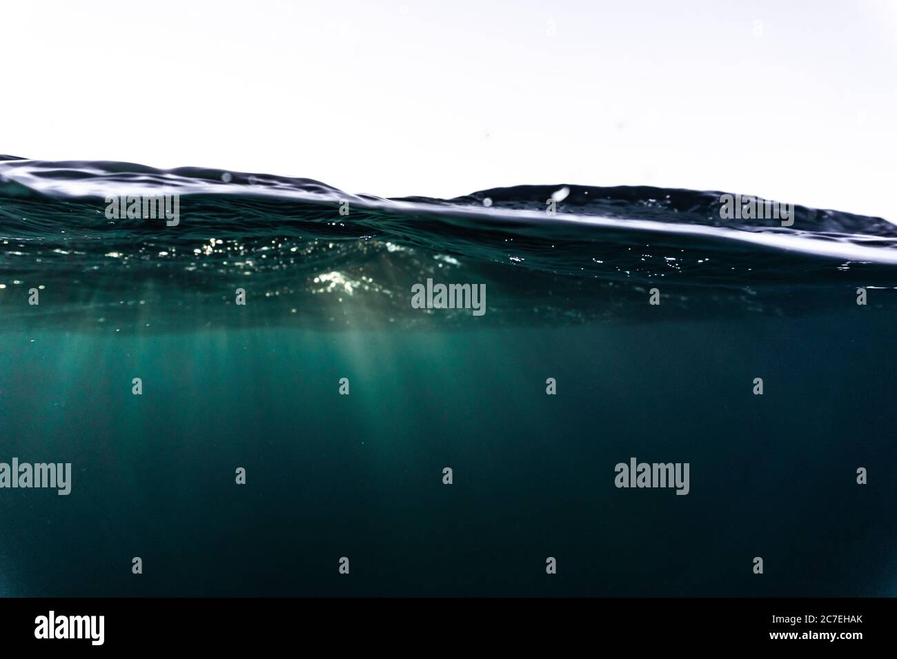 Rays of light shining through the surface of the atlantic ocean, into ...