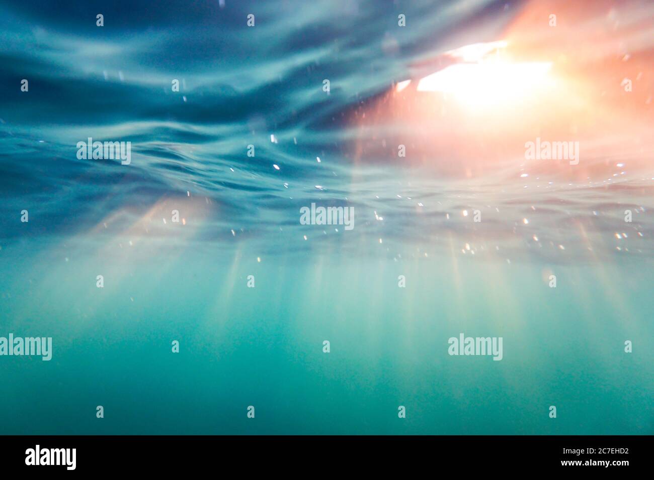 Bright beams of sunlight refracting through the surface of the atlantic ...