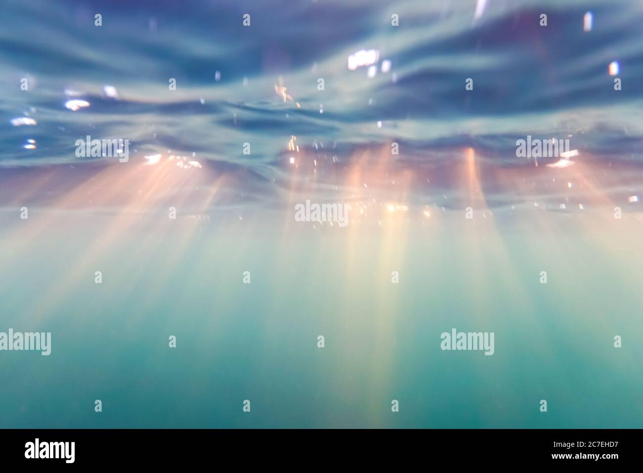 Bright beams of sunlight refracting through the surface of the atlantic ...