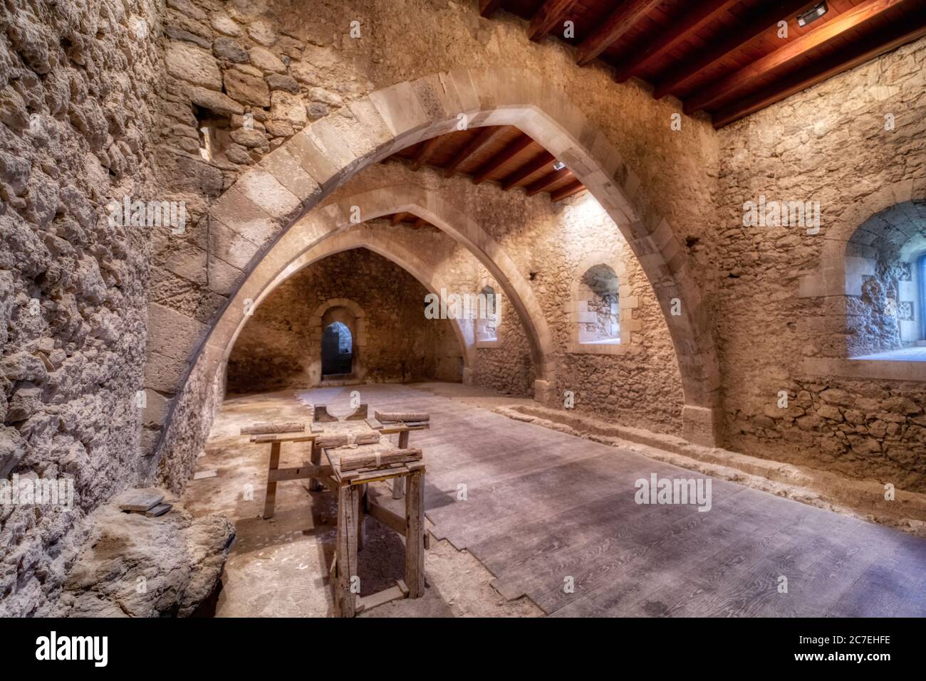Horizontal shot of the inside of an ancient building with an arch ...
