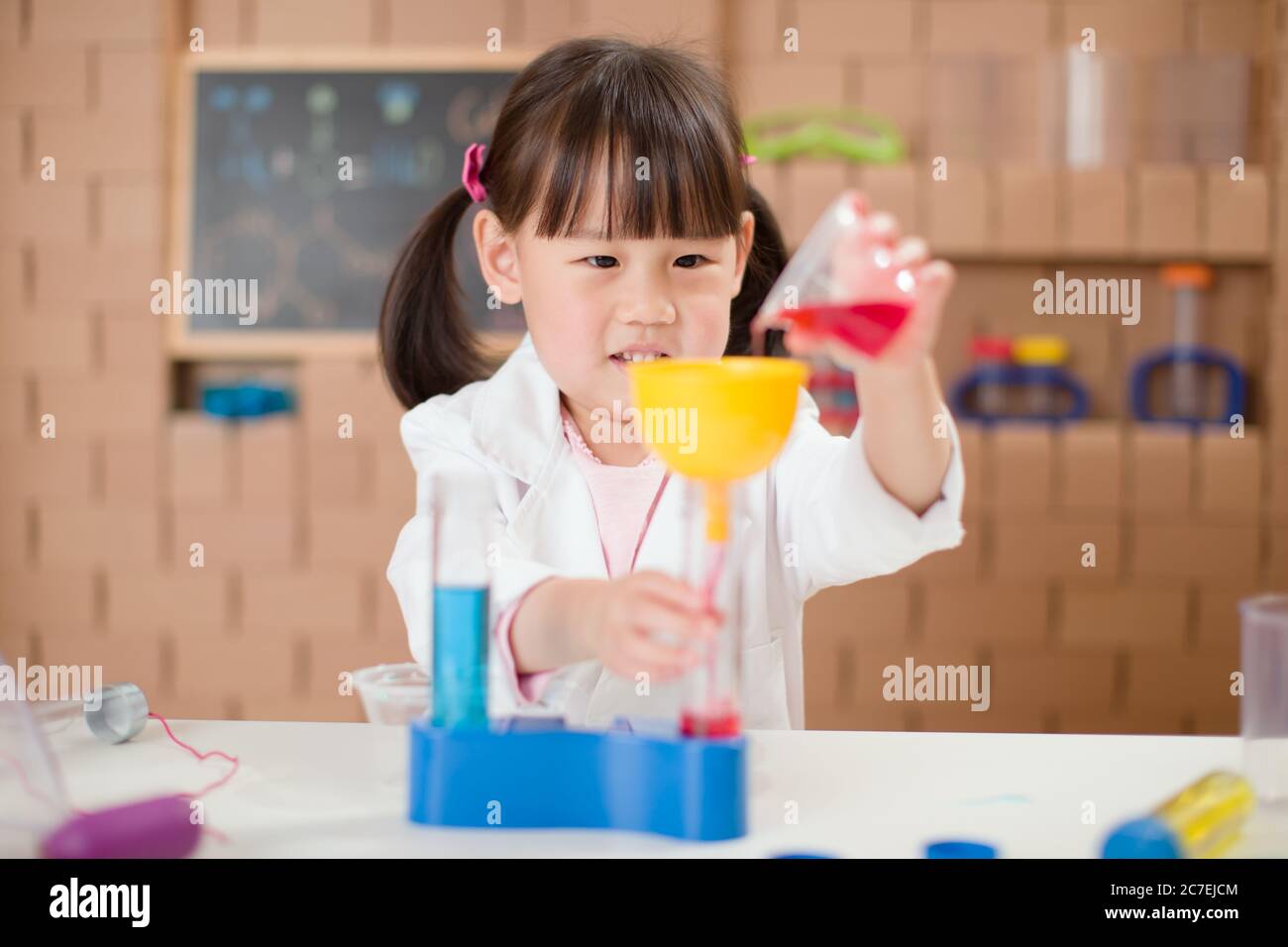 toddler girl play science experiments for homeschooling Stock Photo - Alamy