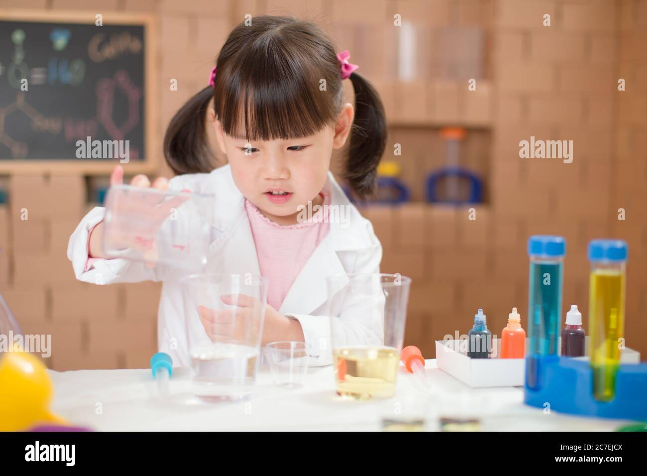 toddler girl play science experiments for homeschooling Stock Photo - Alamy