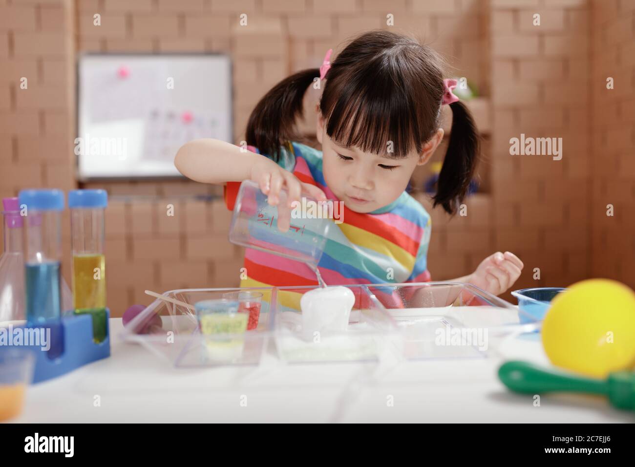 toddler girl play science experiments for homeschooling Stock Photo - Alamy