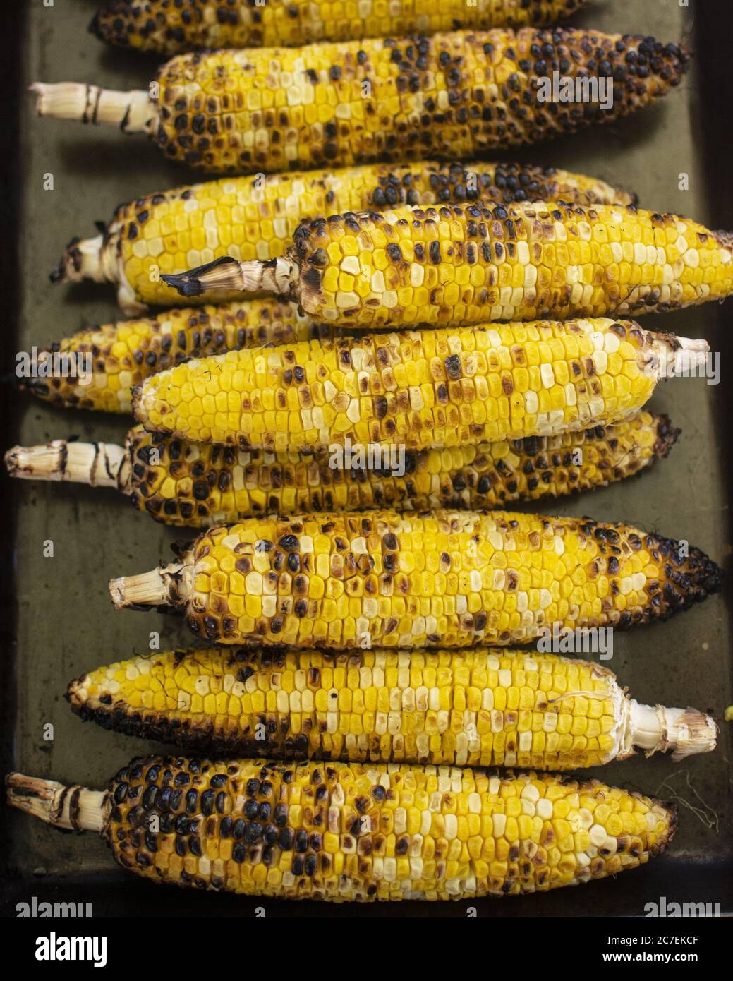 Vertical shot of a stack of grilled corns Stock Photo - Alamy