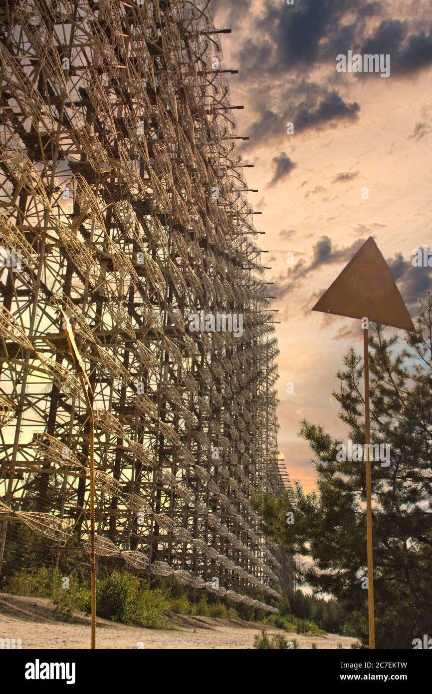 Fairly worn radiation danger sign in front of the huge duga radar ...