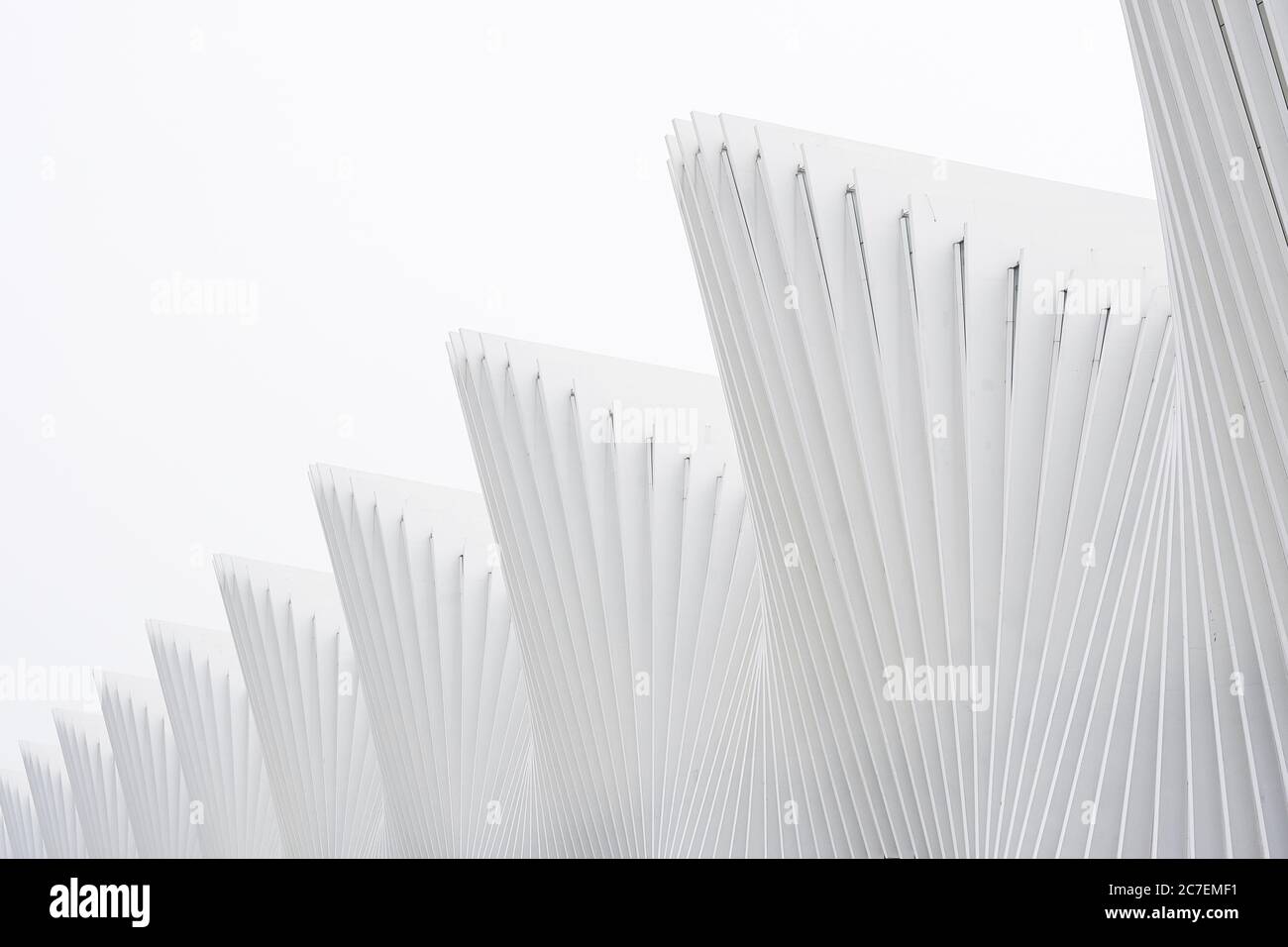 Horizontal shot abstract buildings with white metallic ribs and glass ...