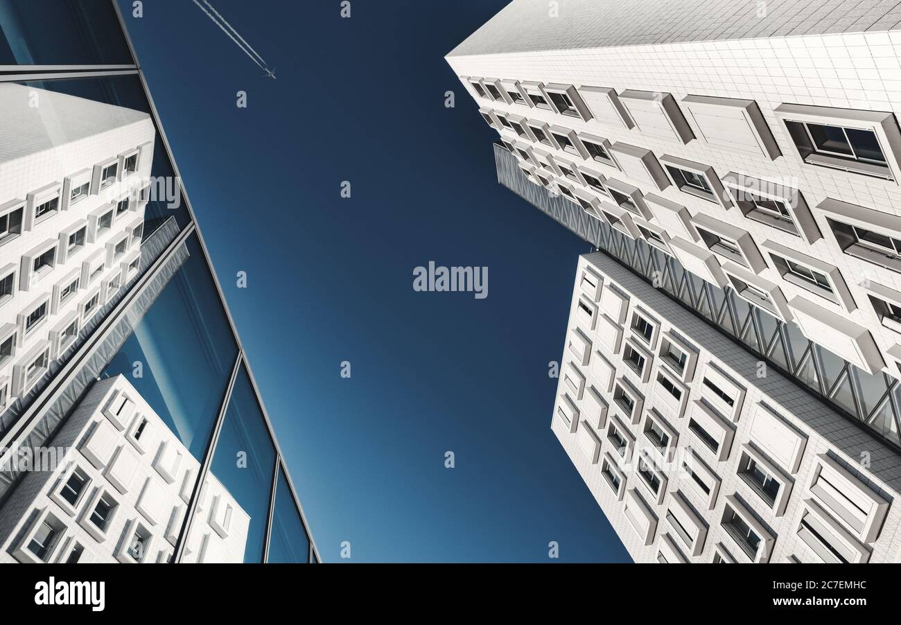 Low angle shot of a modern white building with rectangular windows with ...