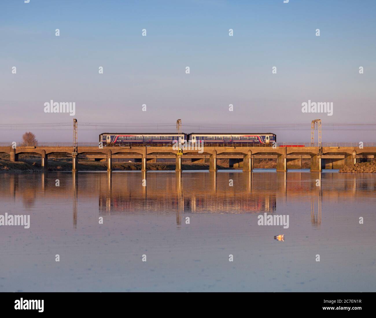 Scotrail class 156 sprinter train crossing the river Esk railway ...