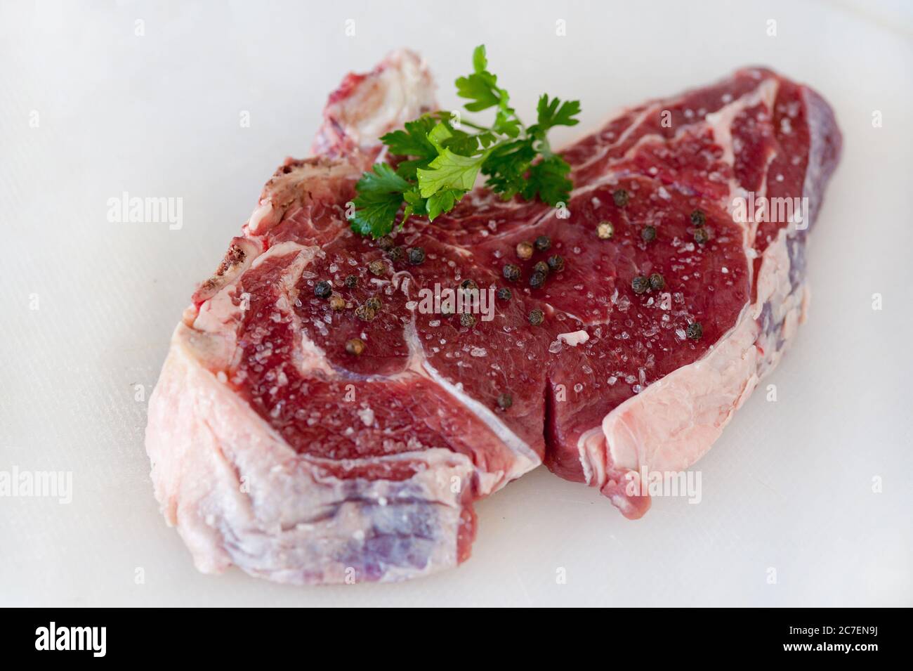 Prime Rib of Beef on a white cutting board Stock Photo - Alamy