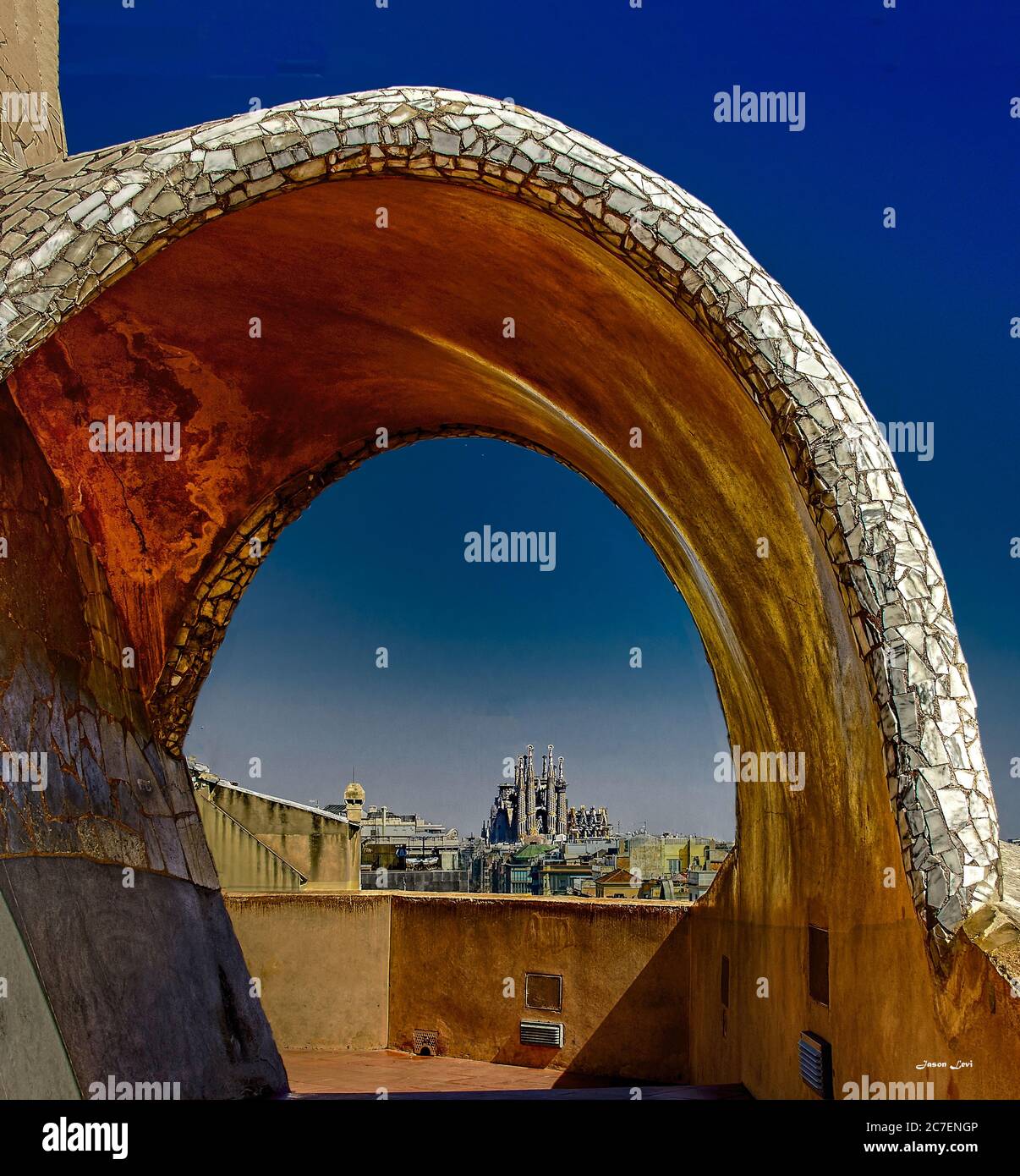 Beautiful shot of a house with an arched architecture and buildings in ...