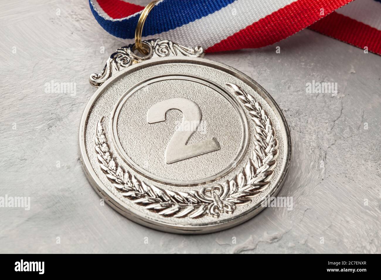 Silver medal. Second place award with ribbon Stock Photo - Alamy