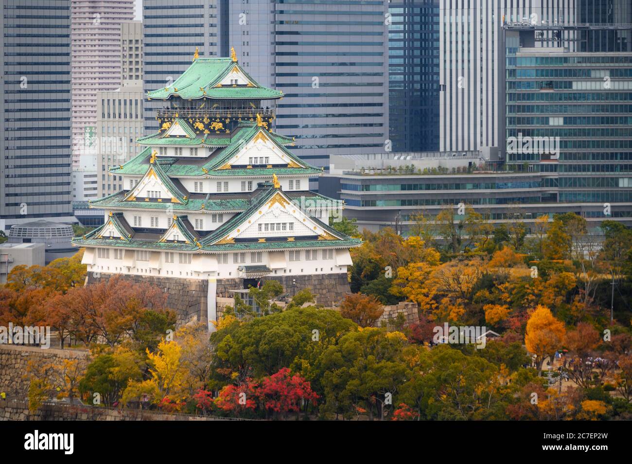 Osaka Castle with Japanese garden and city office building skyscraper ...
