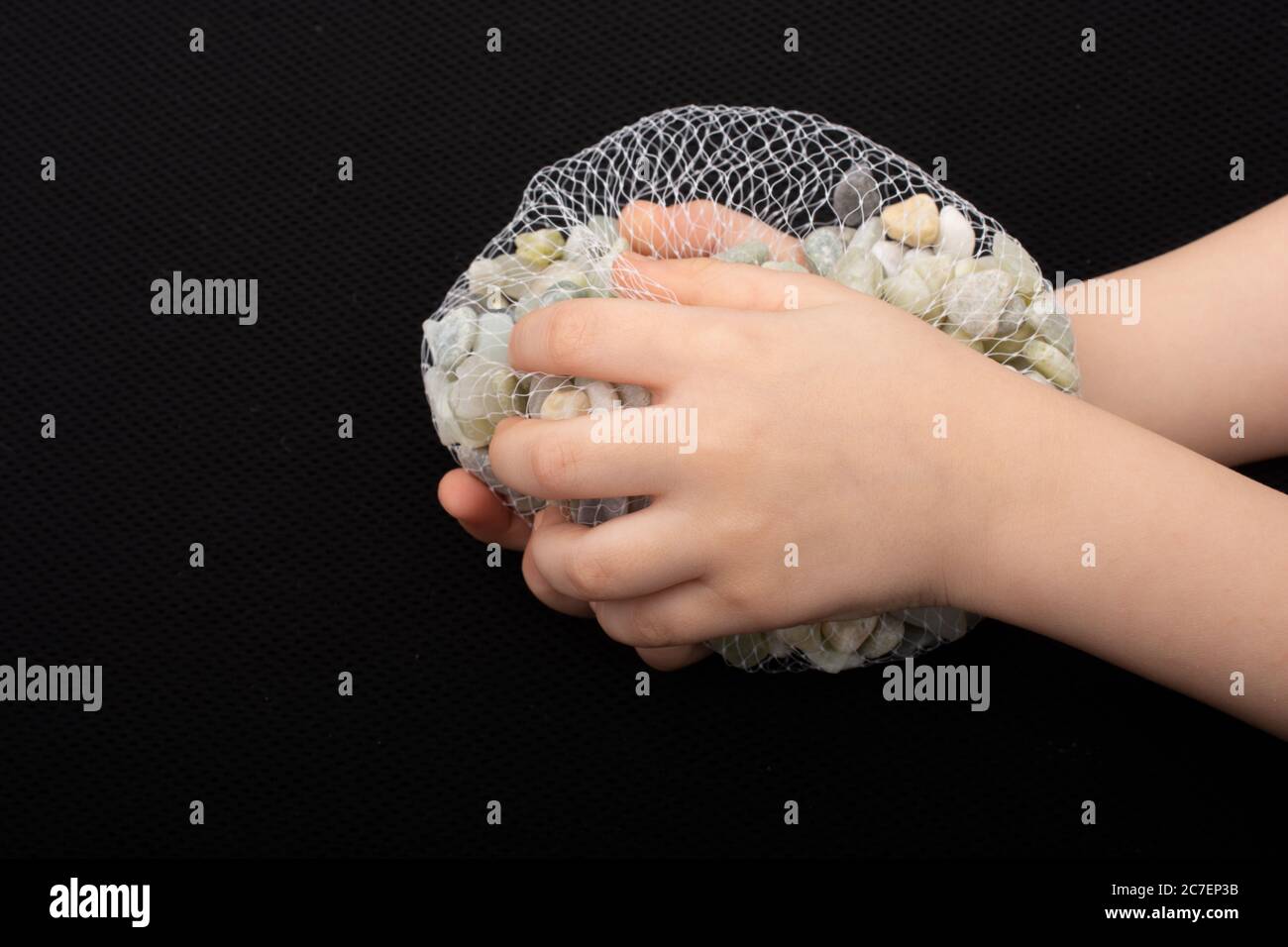 Handful of clean pebbles, gravels in hands Stock Photo - Alamy