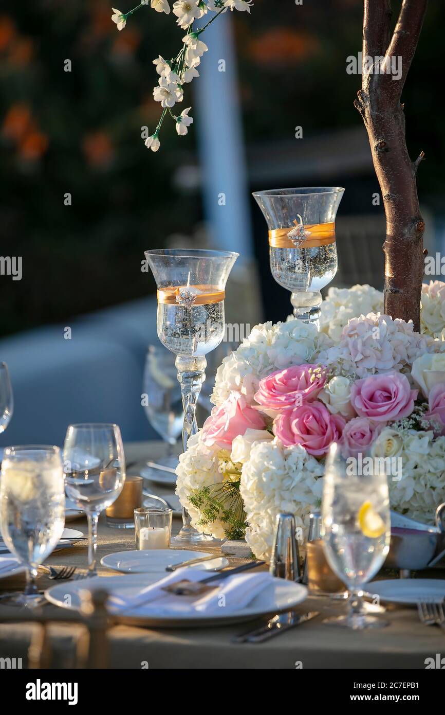 Wedding party table decor for a ceremony during the springtime with ...