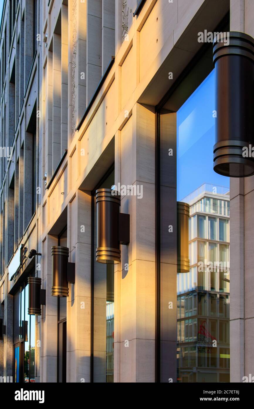 vertical low angle shot of the lower part of a brown building with see ...