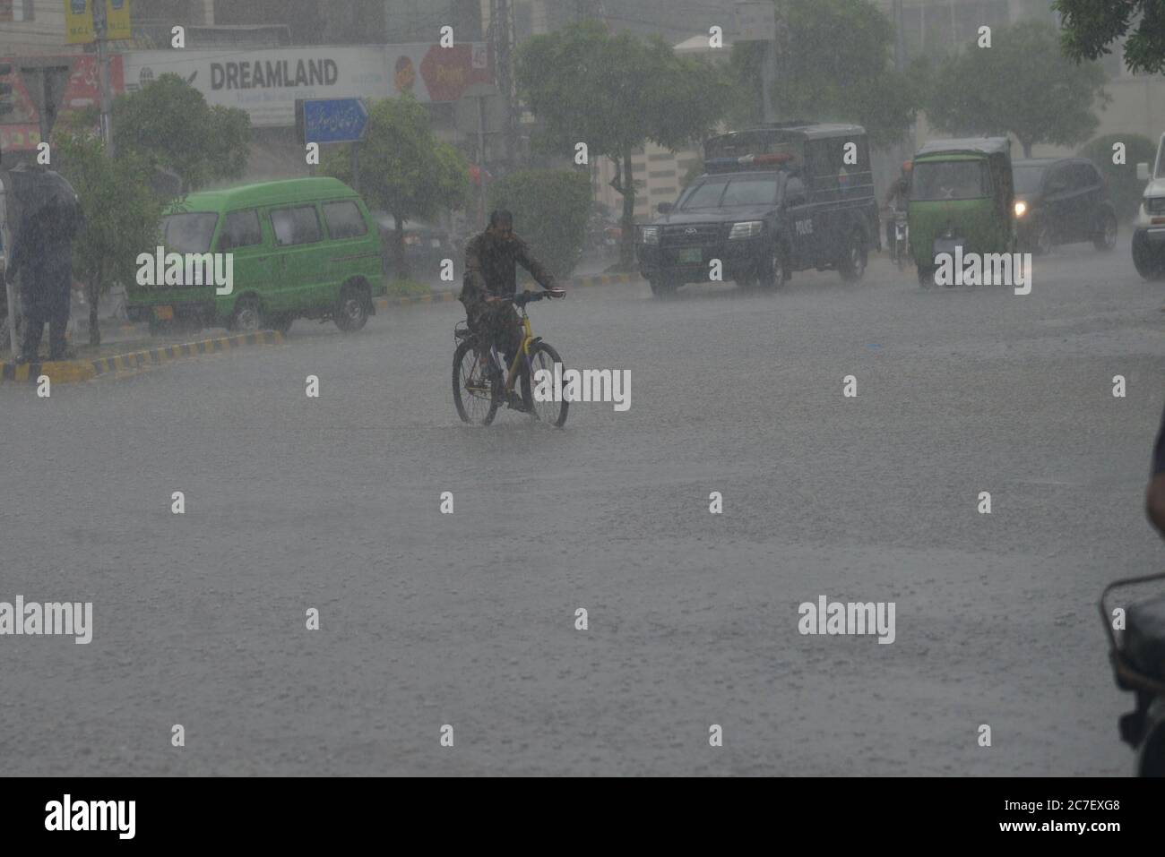 Lahore, Pakistan. 16th July, 2020. Pakistani motorists and vehicles drive through heavy rainfall ...