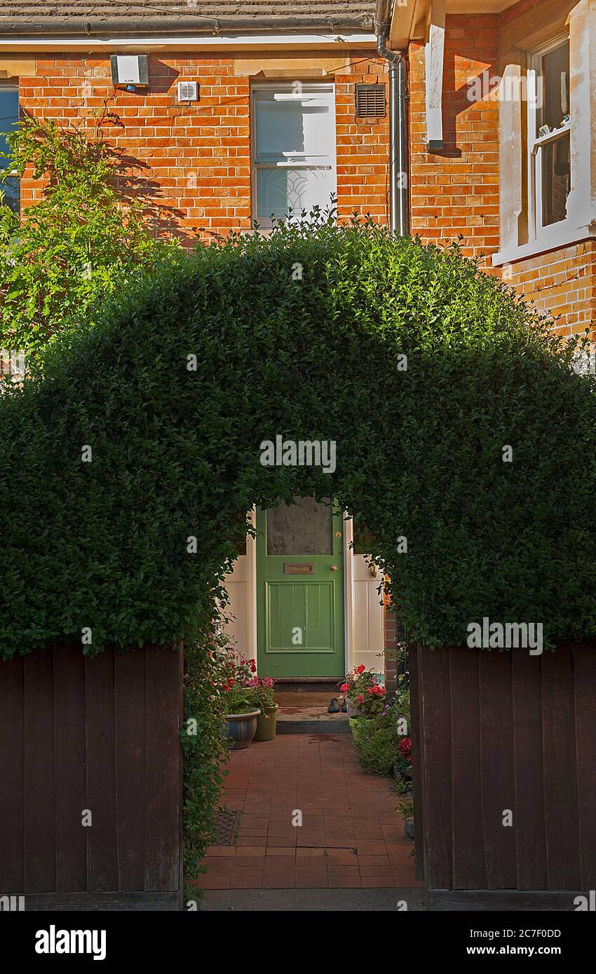 Arched hedge over garden gate hi-res stock photography and images - Alamy