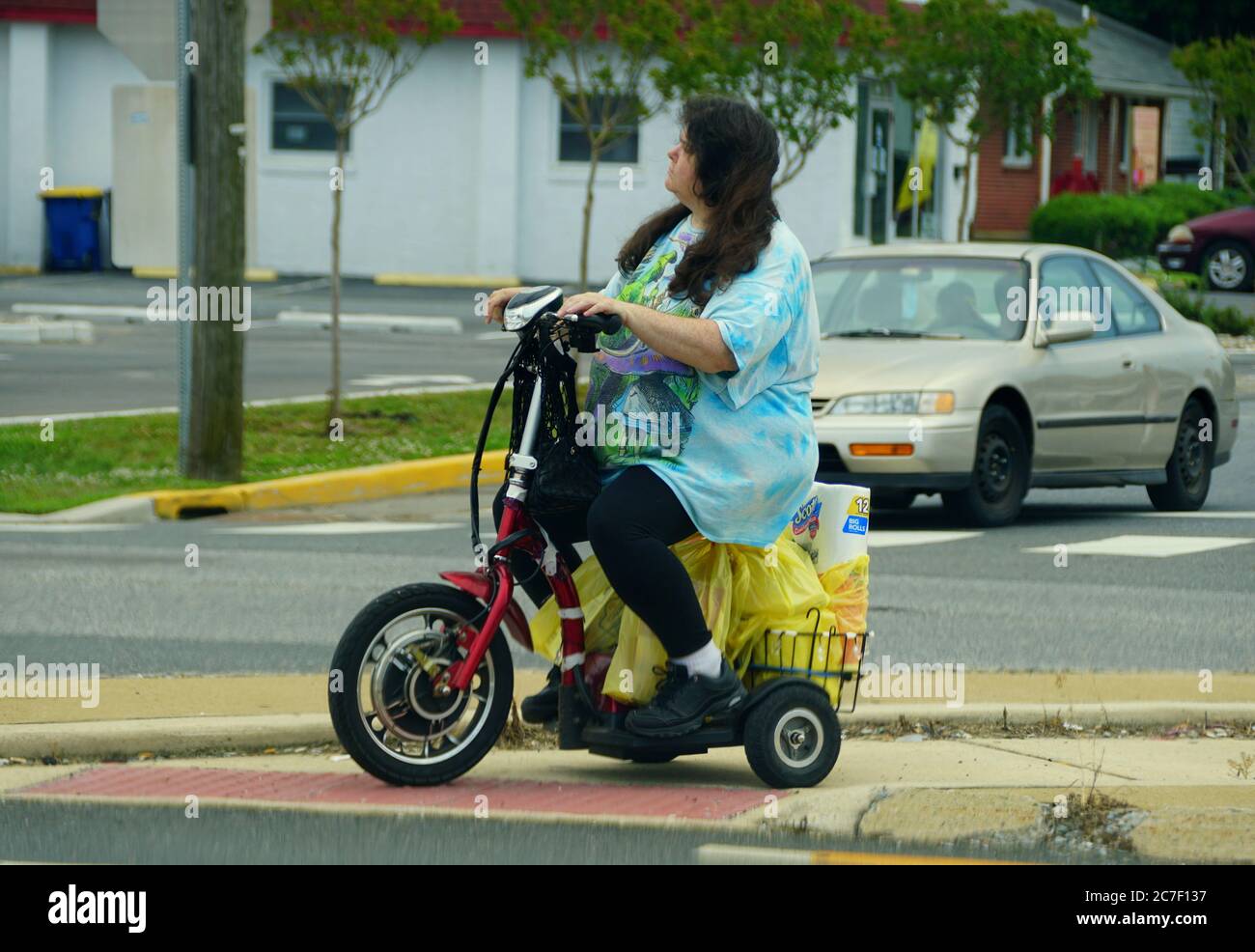 Lady riding scooter hi-res stock photography and images - Alamy