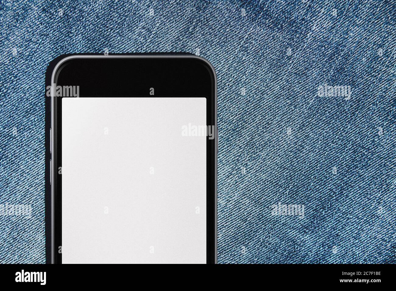 Mobile phone with blank mockup screen in the pocket of blue jeans with ...