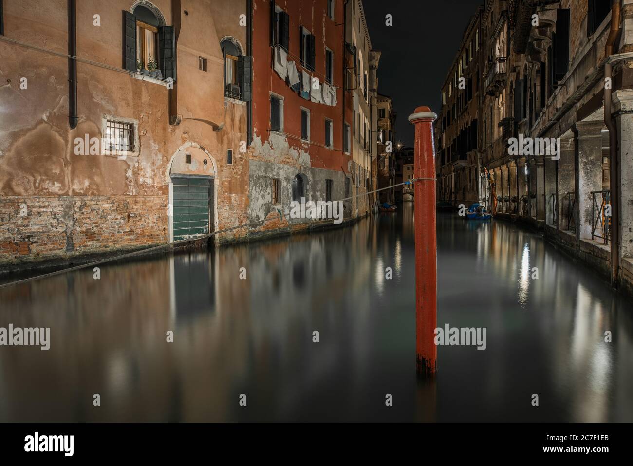 Horizontal shot of a canal between the old buildings in Venice, Italy ...