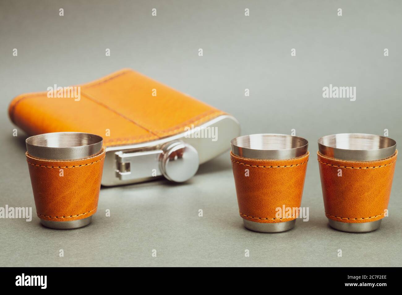 Stainless flask with leather covering. metallic shot glasses. travel personal accessory set for ...