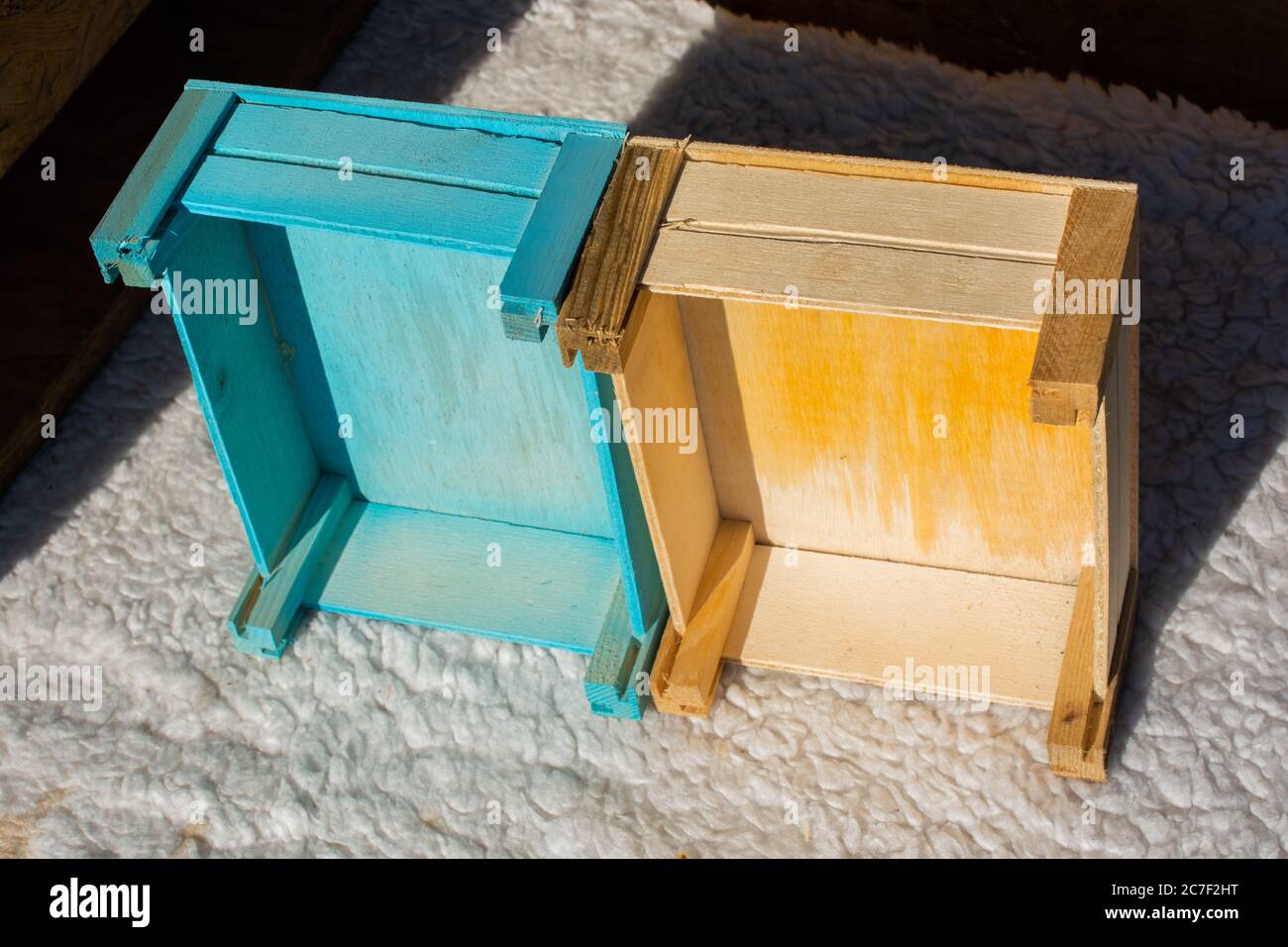 Colorful wooden crate boxes for sale in a market Stock Photo - Alamy