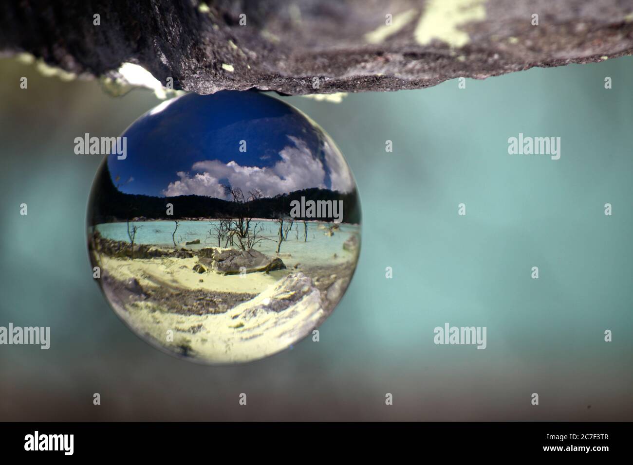 Closeup shot of an Acid lake in Kawah Putih Indonesia reflected in a ...